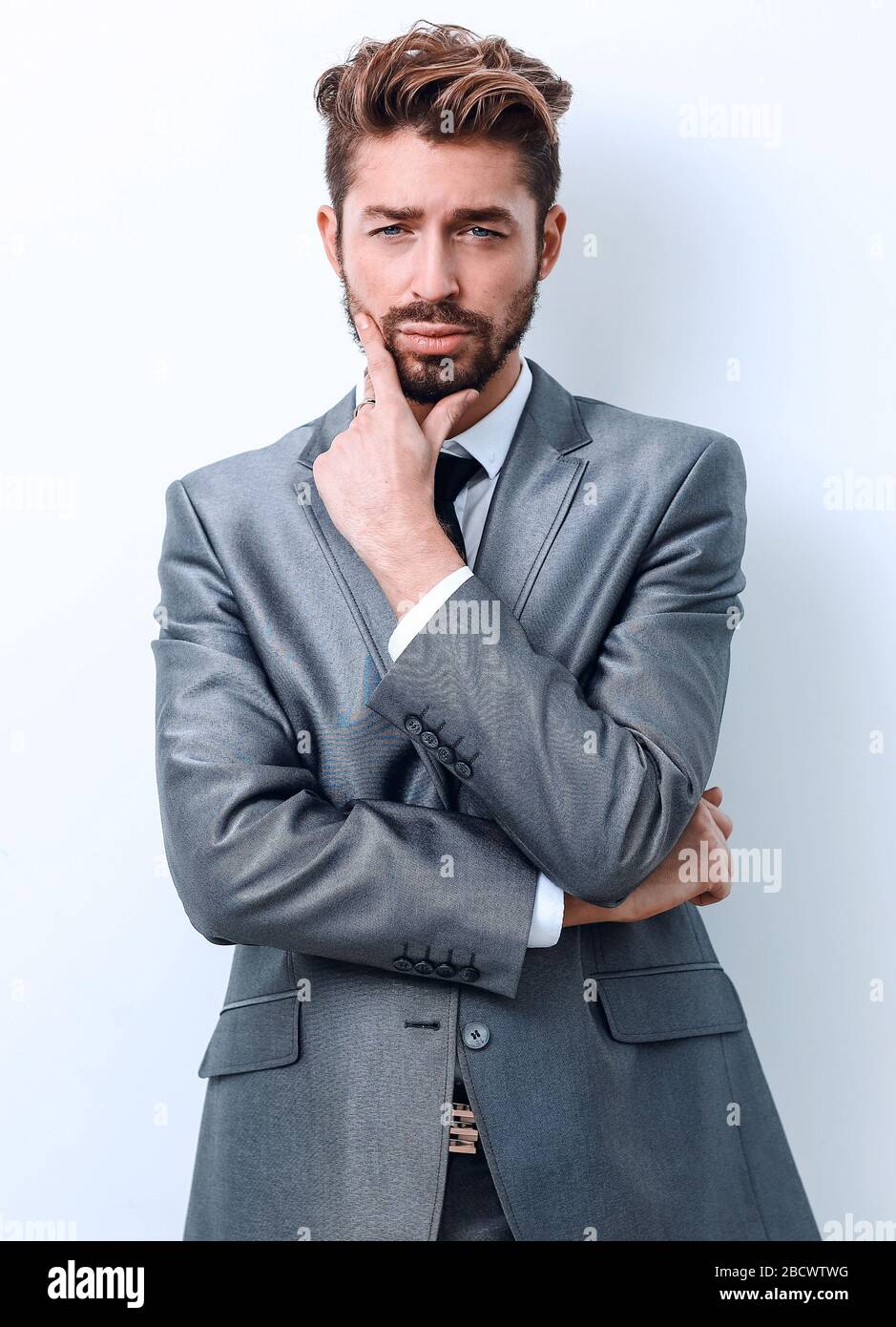 young businessman posing with crossed arms Stock Photo - Alamy