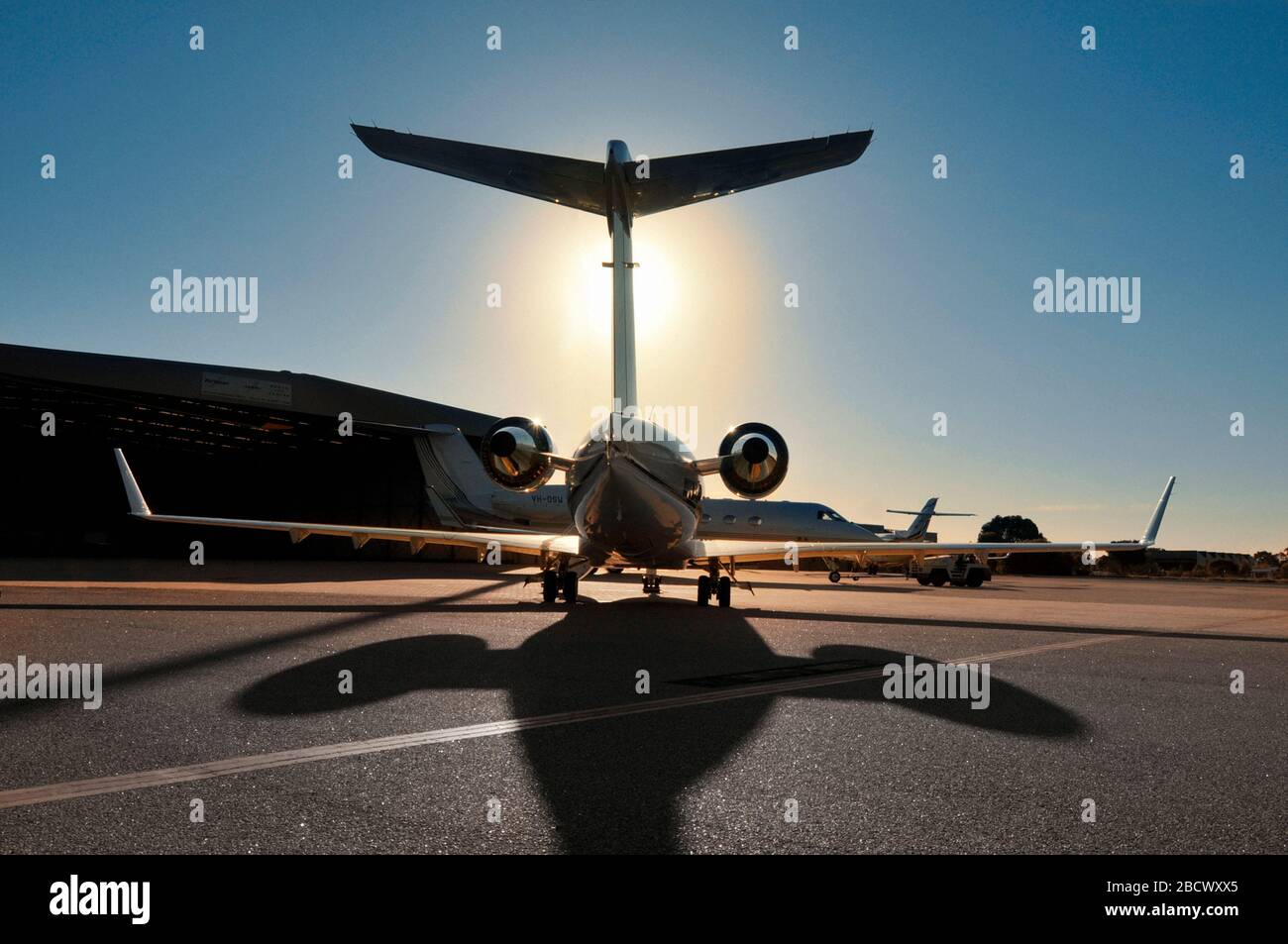 Moody rear end viewpoint of a Bombardier Challenger executive jet at an ...