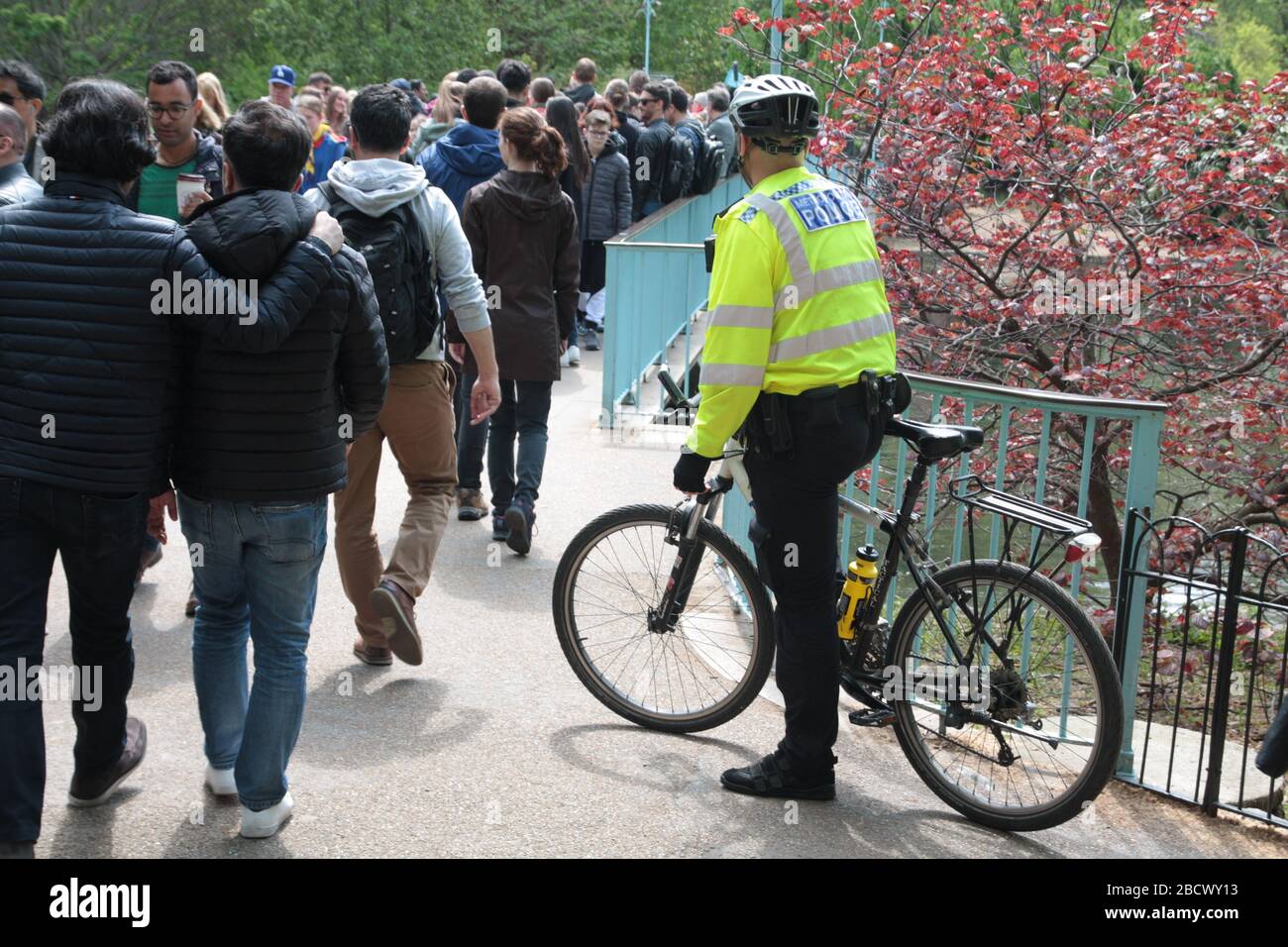 London Metropolitan Police officer on a bicycle, Blue Bridge, Saint ...