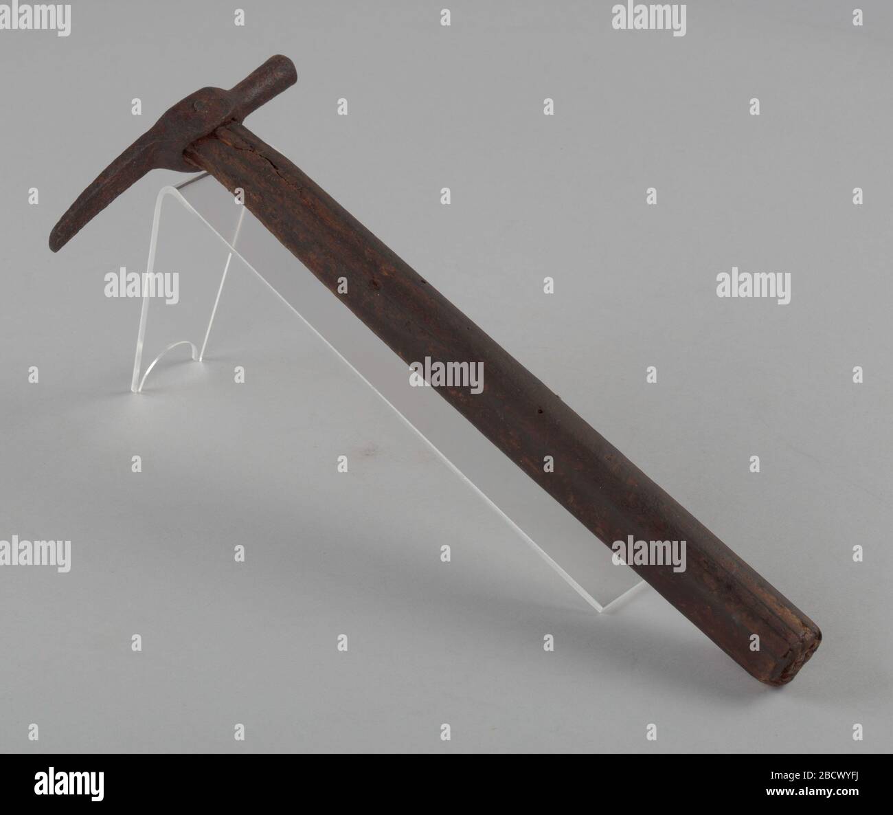 Culling hammer. An oyster hammer with a metal head and wood handle. The ...