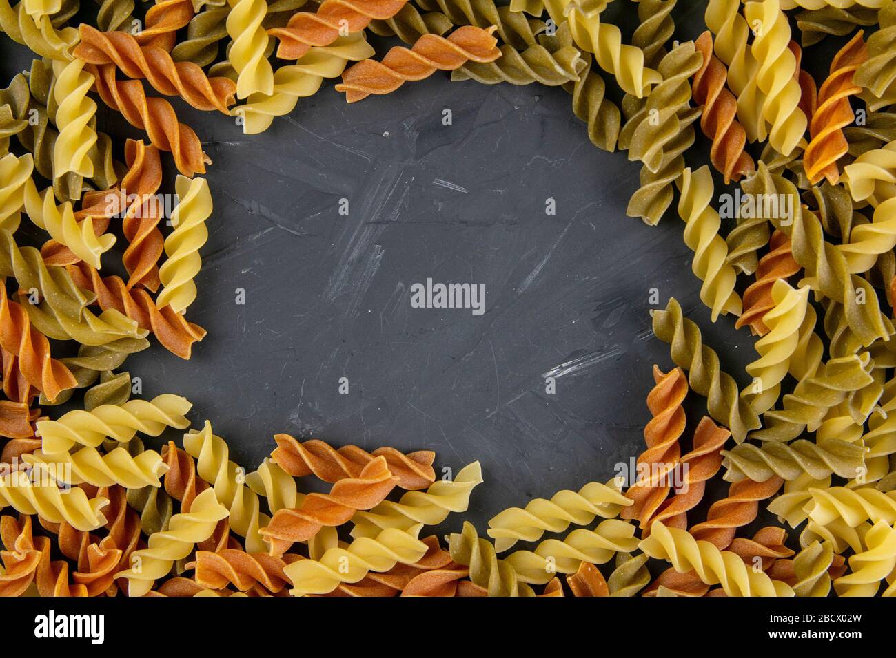 Fusili pasta. Closeup of raw fusilli macaroni in spiral shape with ...