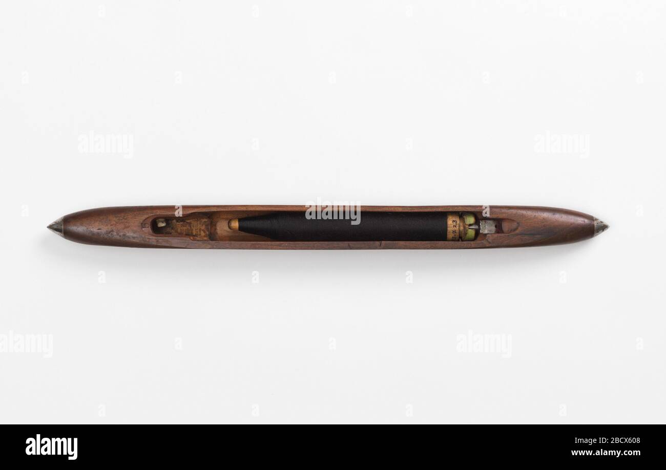 Shuttle and bobbin. Research in ProgressA dark finely grained wooden ...