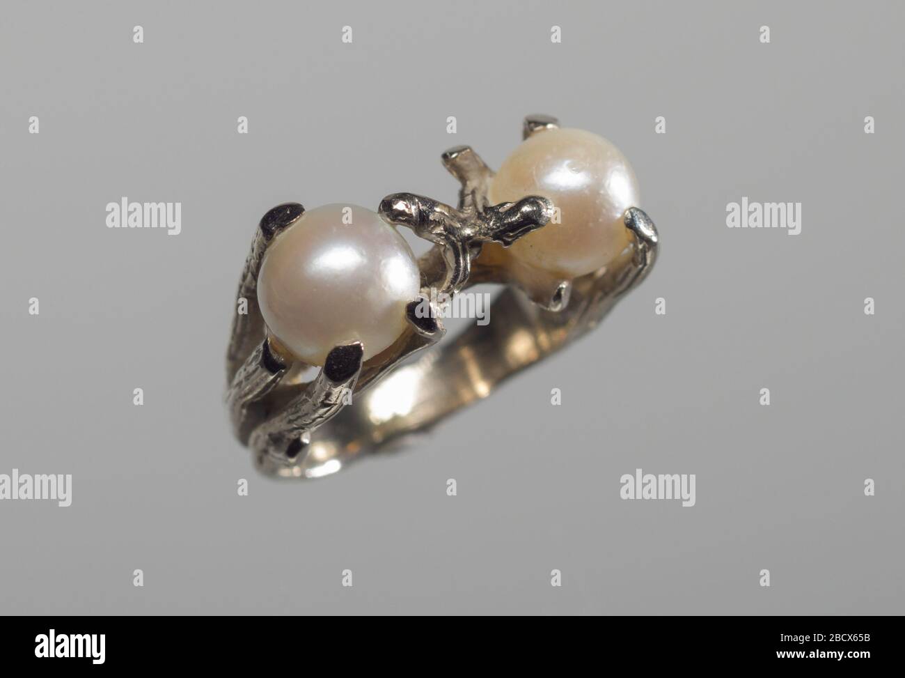 Ring owned by Ginger Smock. A white gold ring with two pearl settings ...