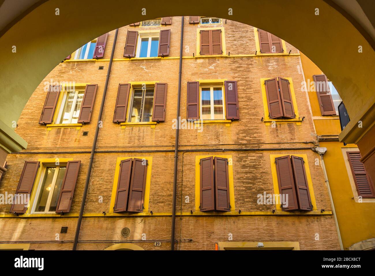 typical windows of ancient buildings in the historical center of Modena ...