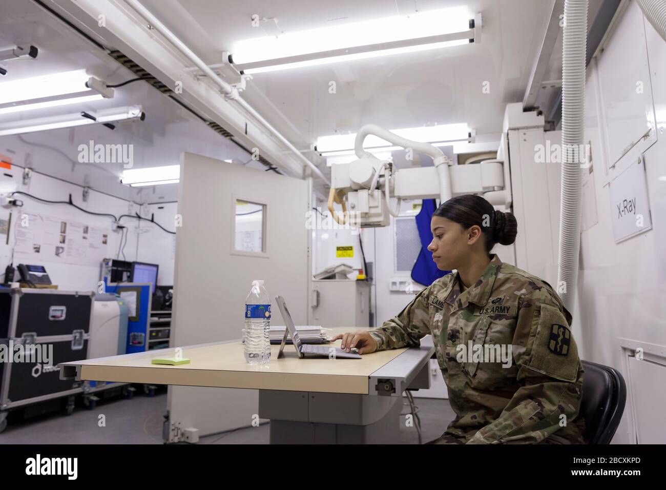 Staff Sergeant Jordan Lambert, an X-ray technician, prepares the ...