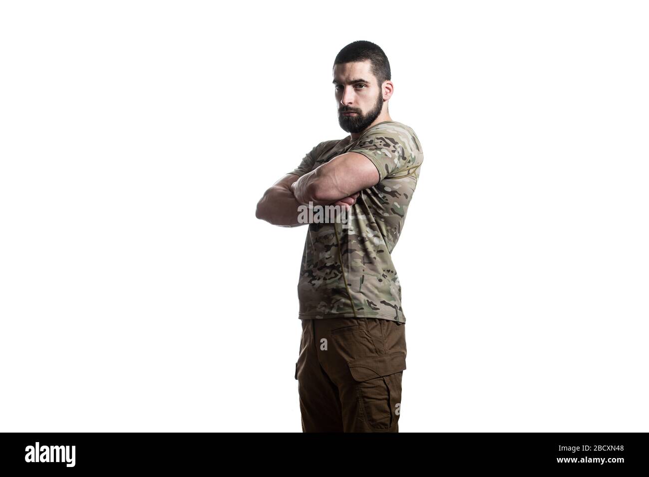 Portrait of Young Soldier Arms Crossed on a White Background Stock ...