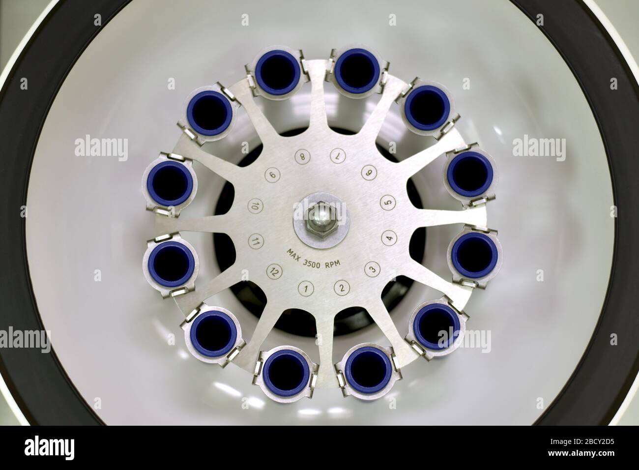 Laboratory open centrifuge with empty test tube compartments. View from ...