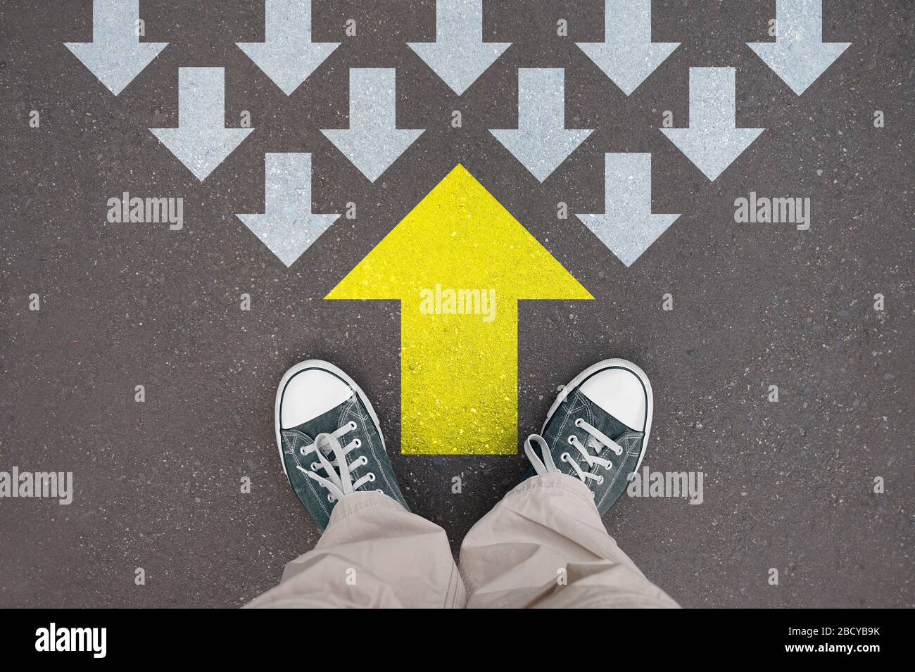 Shoes, trainers - arrows in opposite direction Stock Photo - Alamy