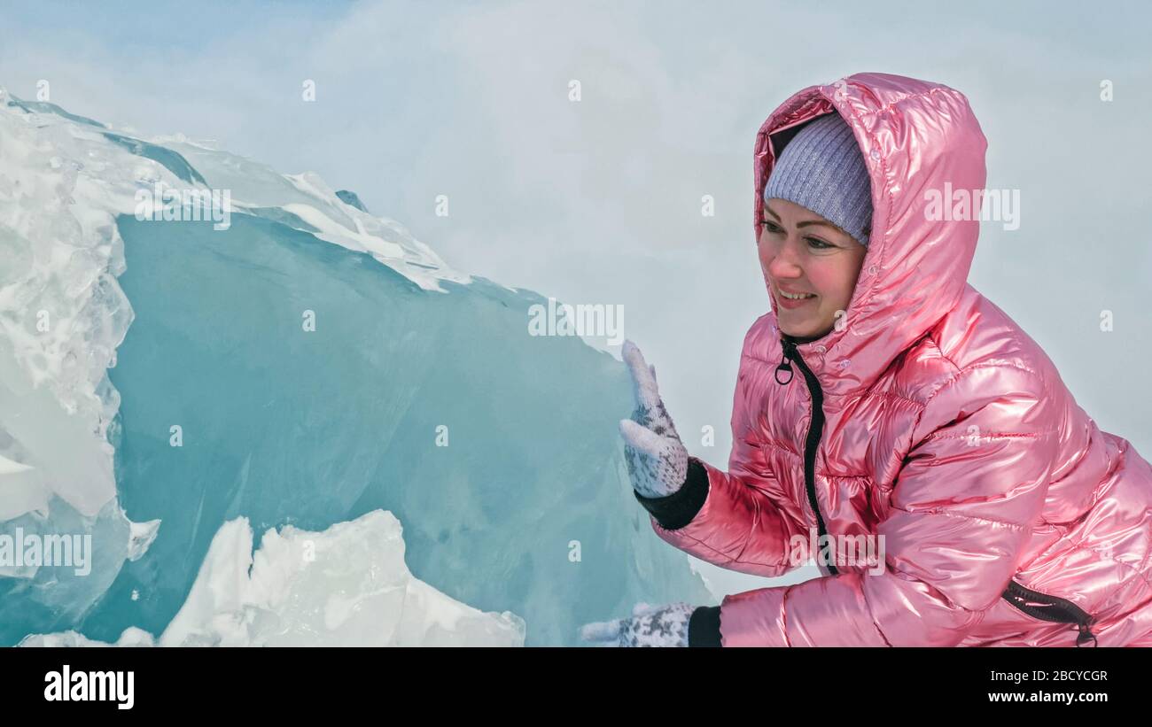 Girl walking on cracked ice of a frozen lake Baikal. Woman trave Stock ...