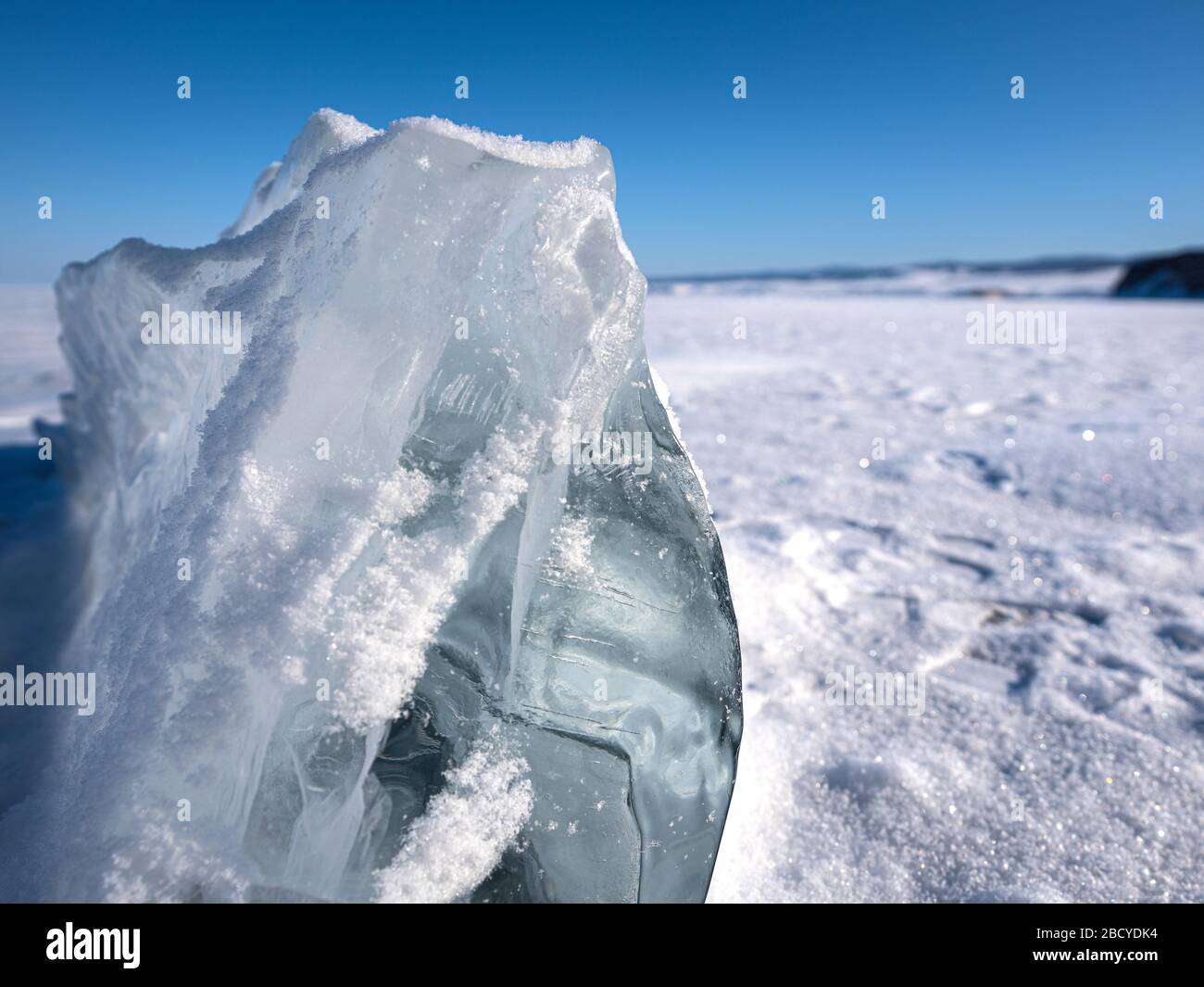The icy beauty of ice cube, unusual shapes. Closeup crystal clear ice ...