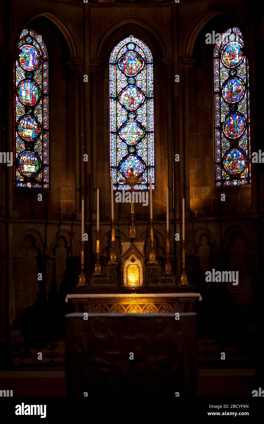 Stained Glass Windows And Candles Behind Altar Notre Dame Church