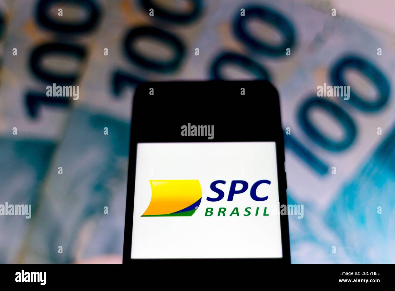 In this photo illustration a SPC Brasil logo seen displayed on a ...