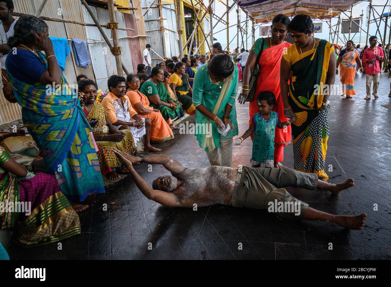 A pilgrim rolling in worship in Panjalinga Sannathi, Tiruchendur, India ...