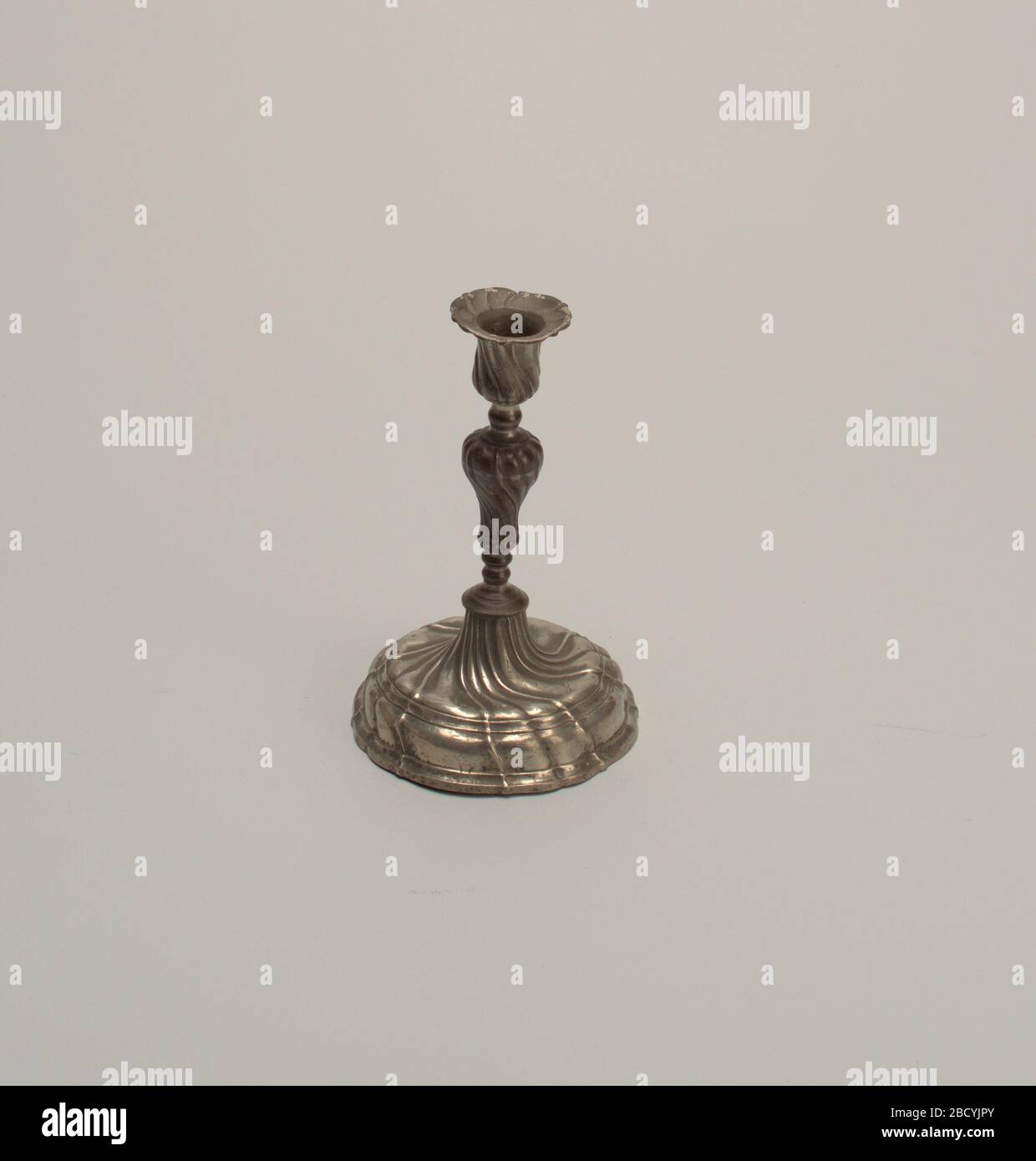 Candlestick. Research in ProgressGadrooned foot, baluster stem and ...