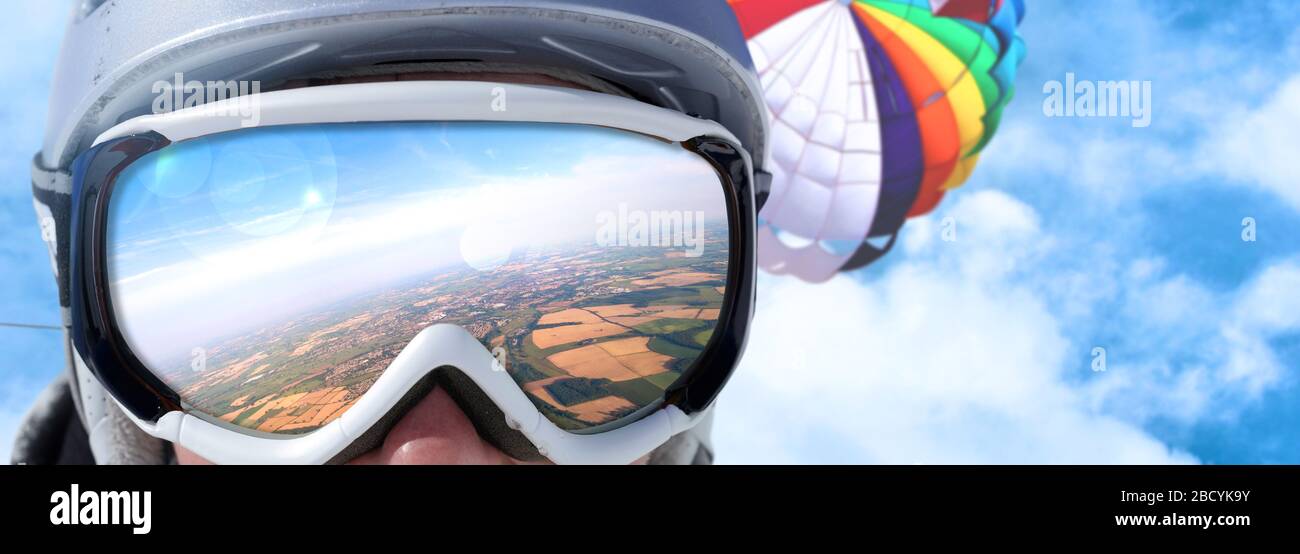Goggles of a skydiver reflecting the landscape scenery below Stock ...