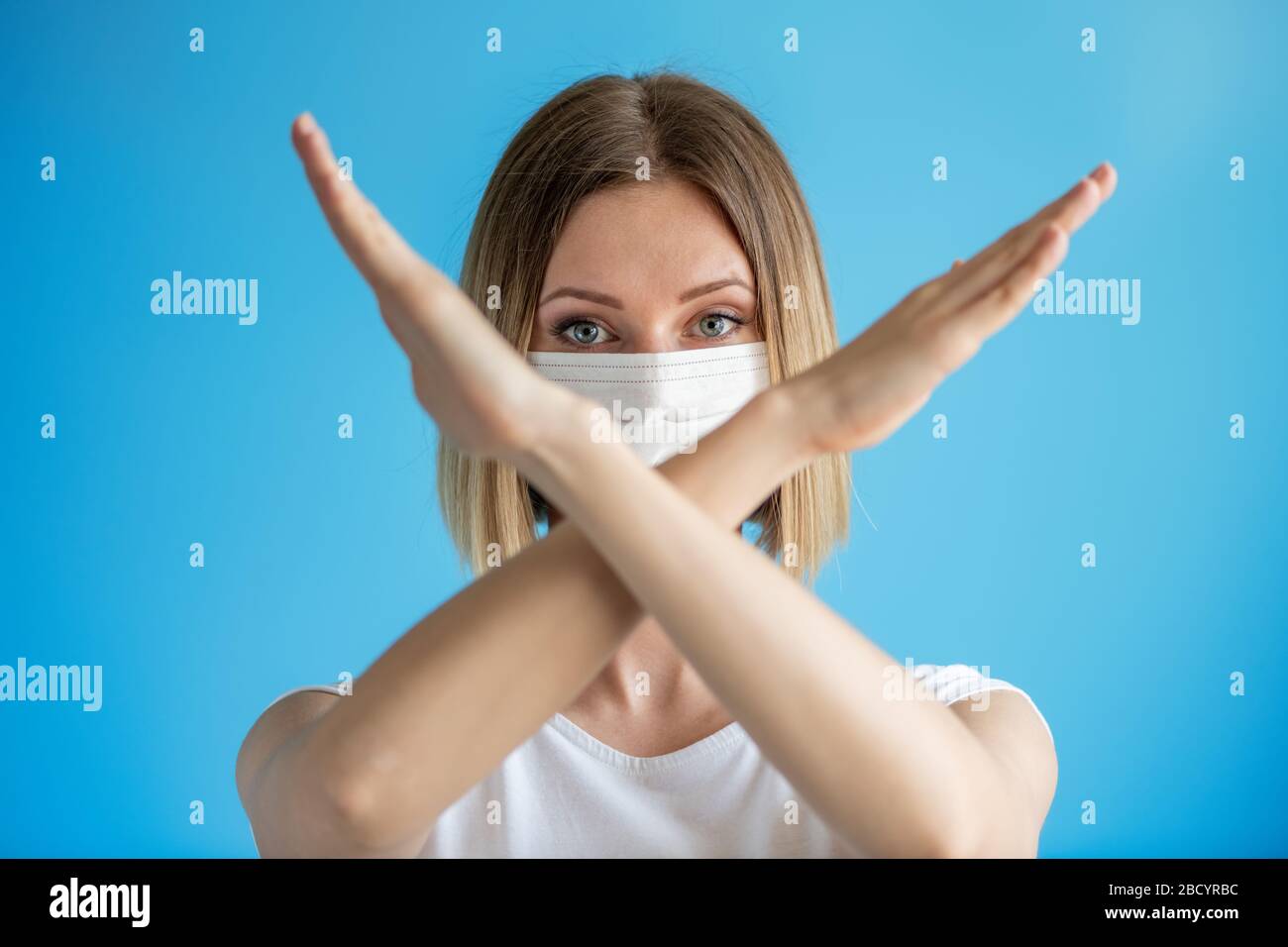Attractive female nurse showing stop sign with his hand gesture ...