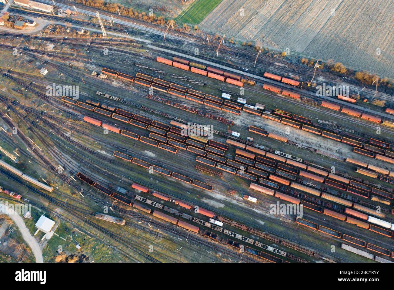Aerial view of various railway carriage trains with goods on the ...