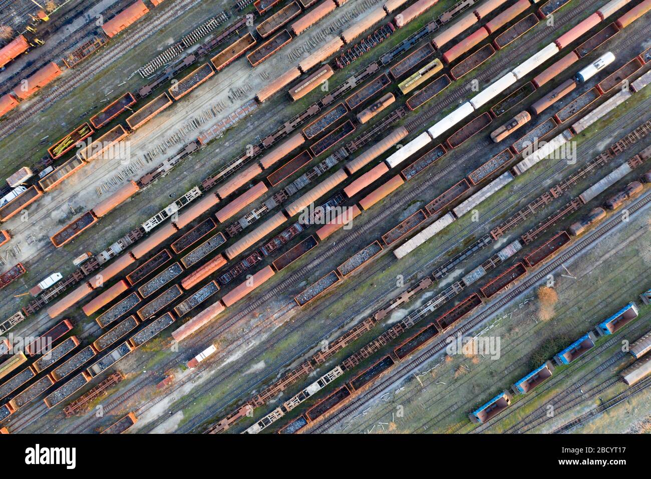 Aerial view of various railway carriage trains with goods on the ...