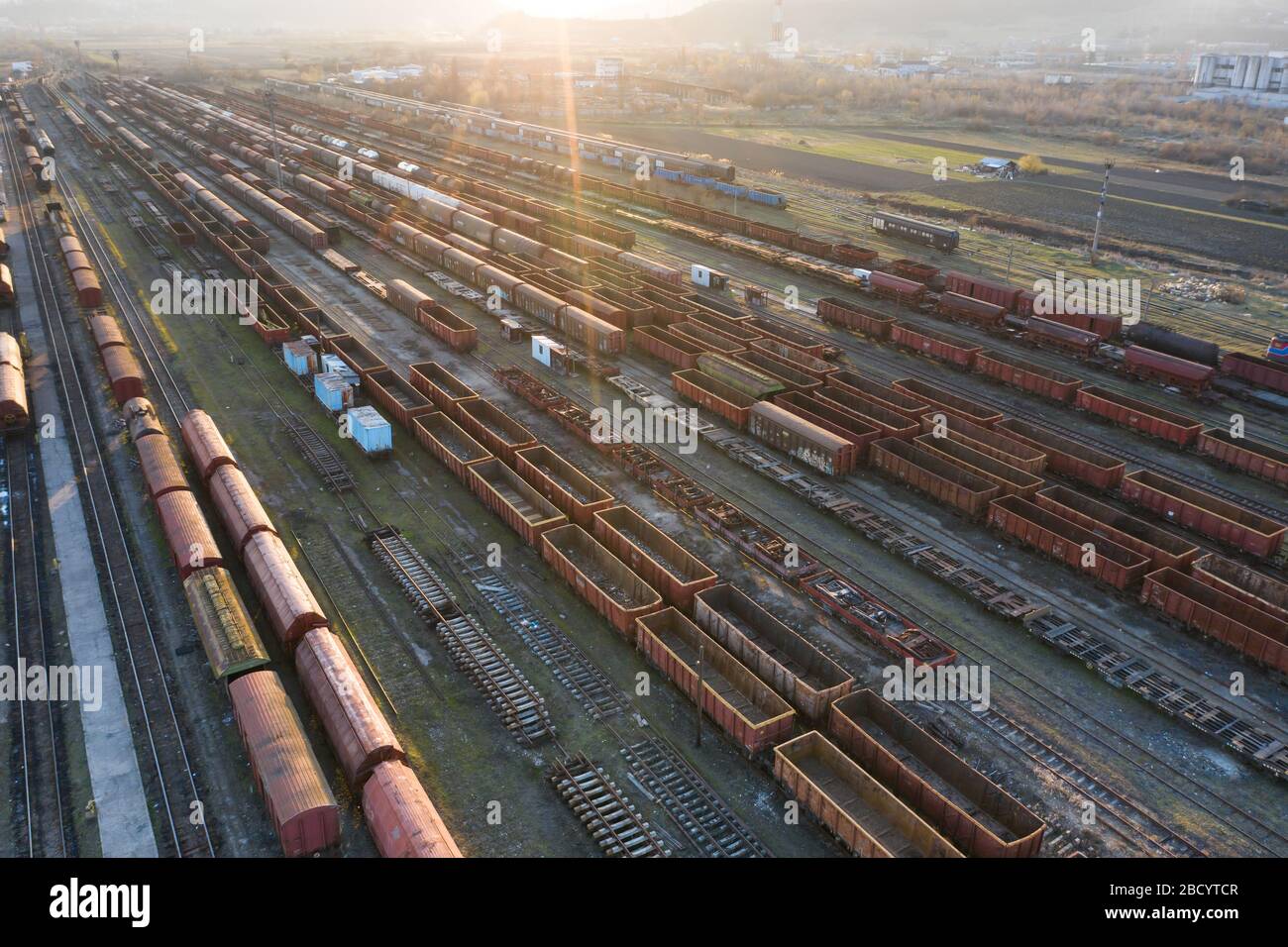 Aerial view of various railway carriage trains with goods on the ...