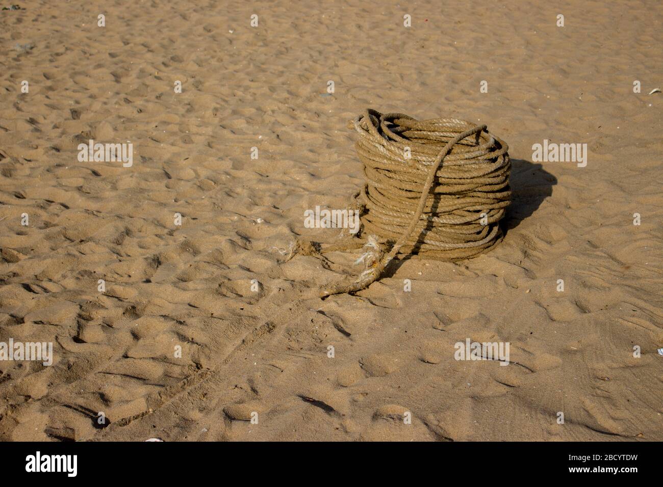 Bunch of fishing rope on beach sand - using fishing rope Stock Photo ...