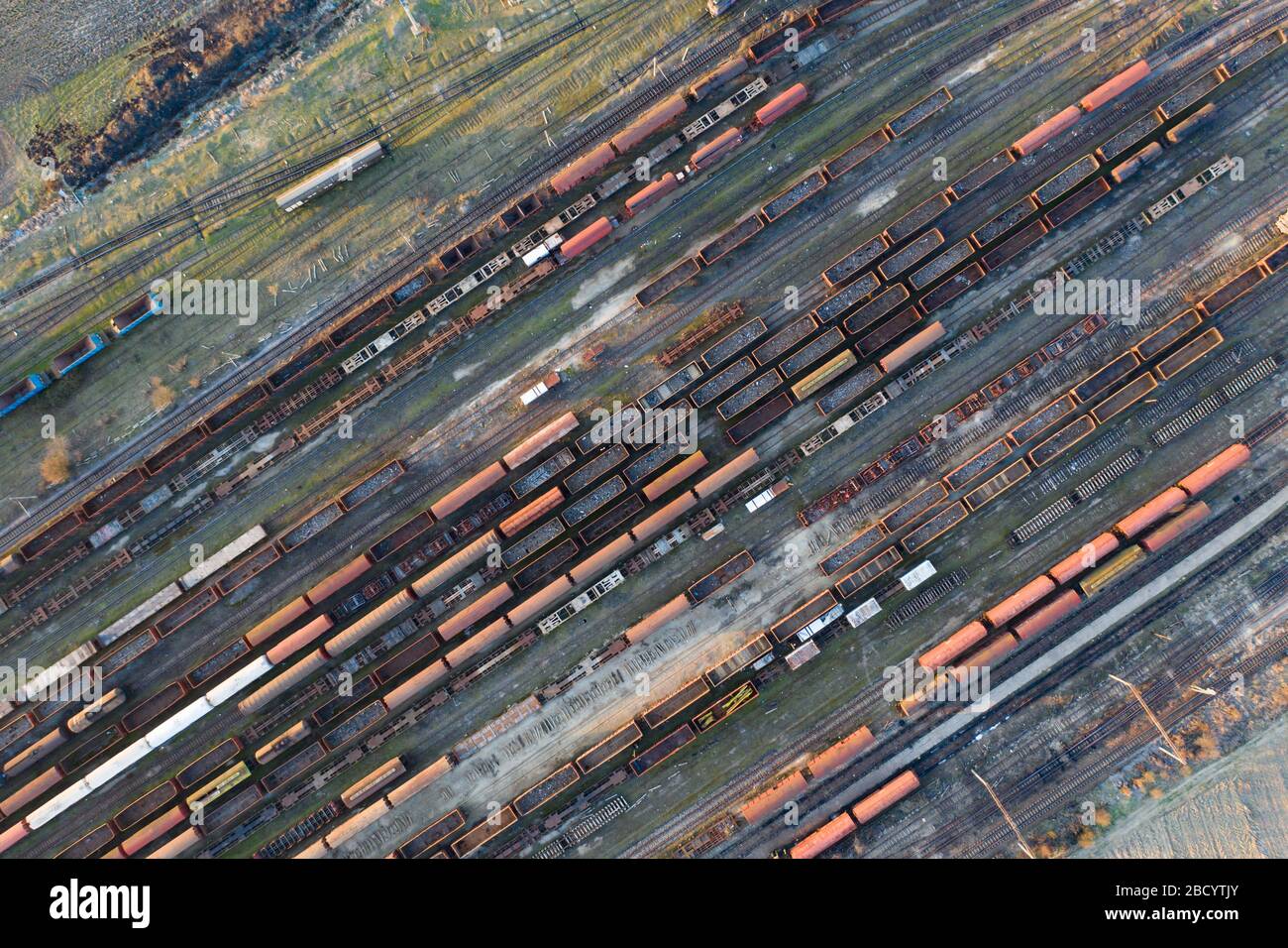 Aerial view of various railway carriage trains with goods on the ...