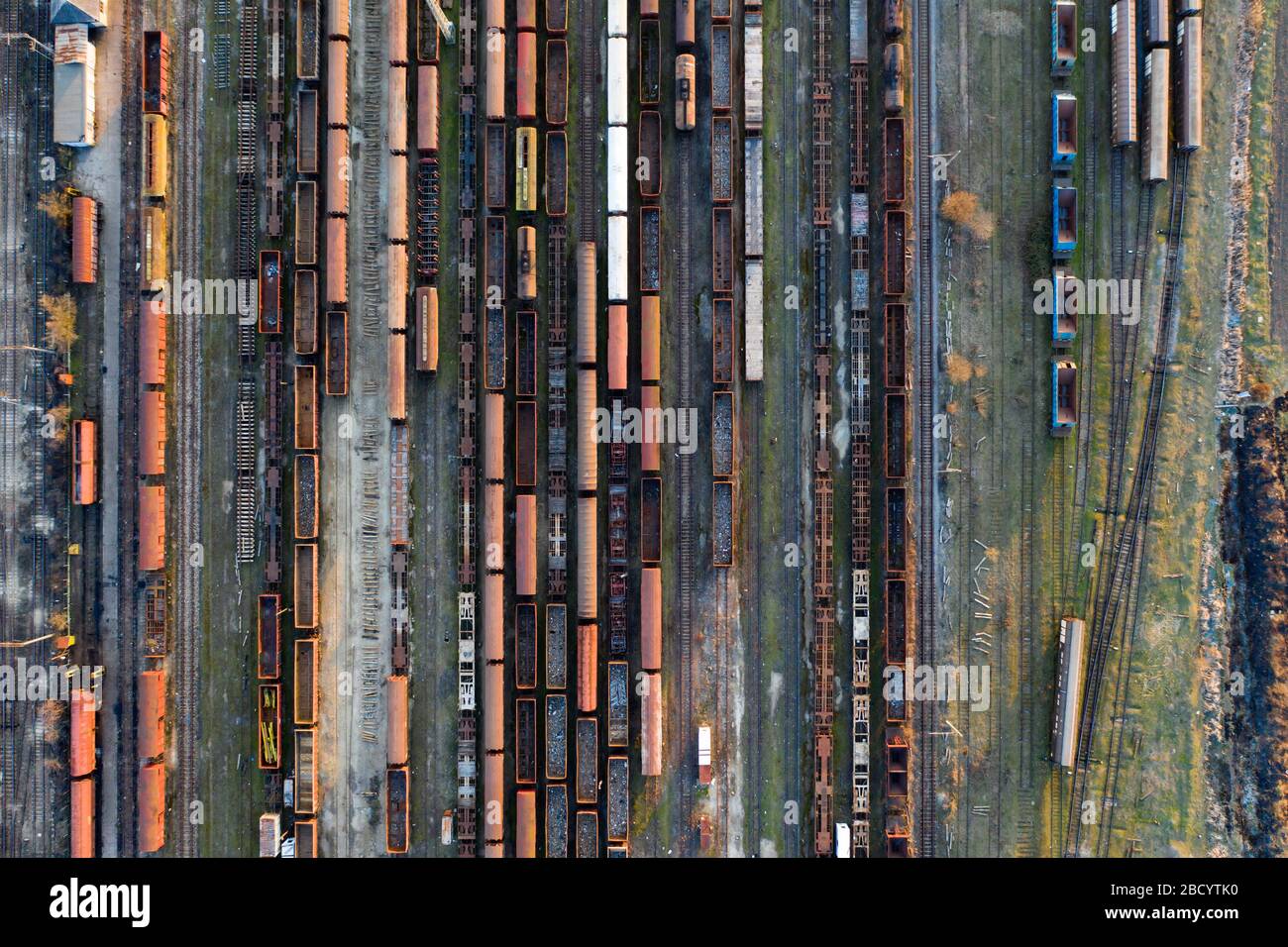 Aerial view of various railway carriage trains with goods on the ...