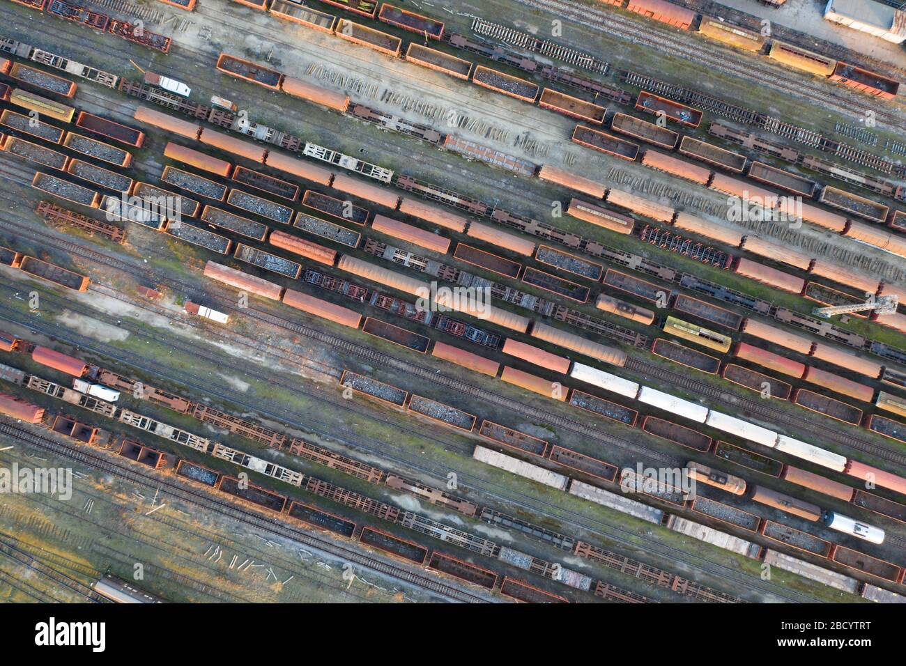 Aerial view of various railway carriage trains with goods on the ...