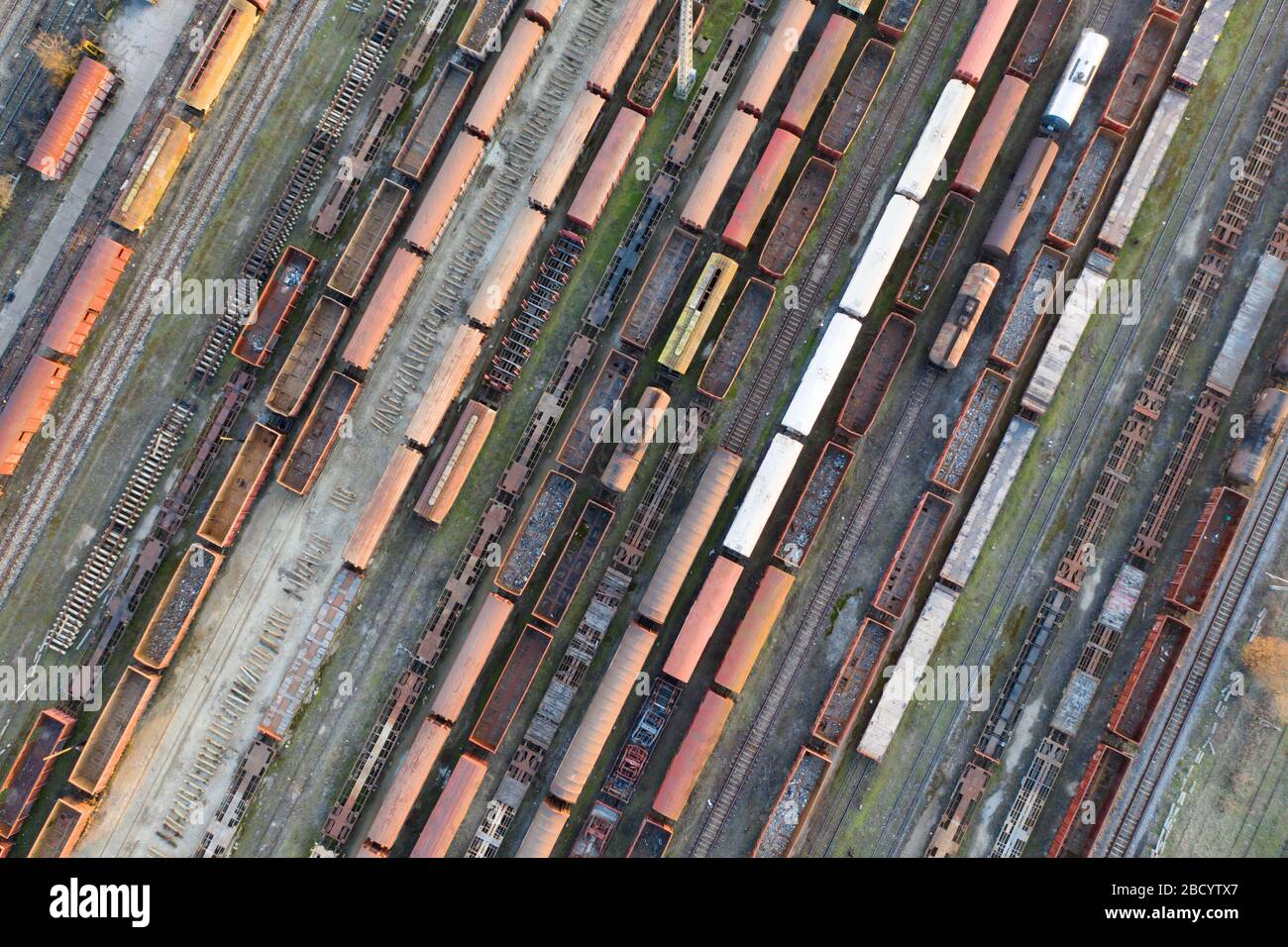 Aerial view of various railway carriage trains with goods on the ...