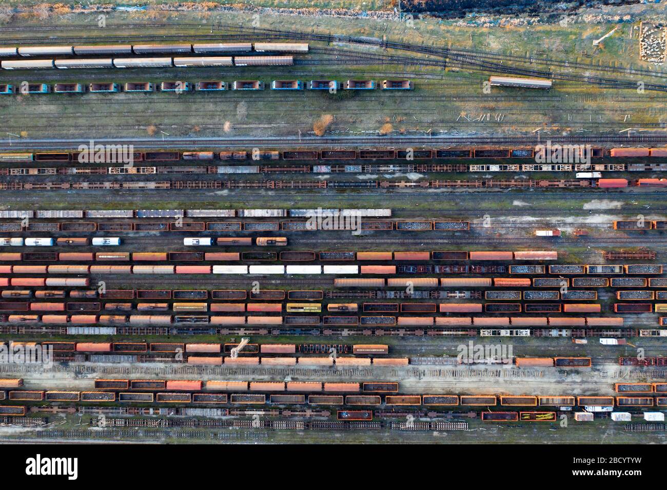 Aerial view of various railway carriage trains with goods on the ...