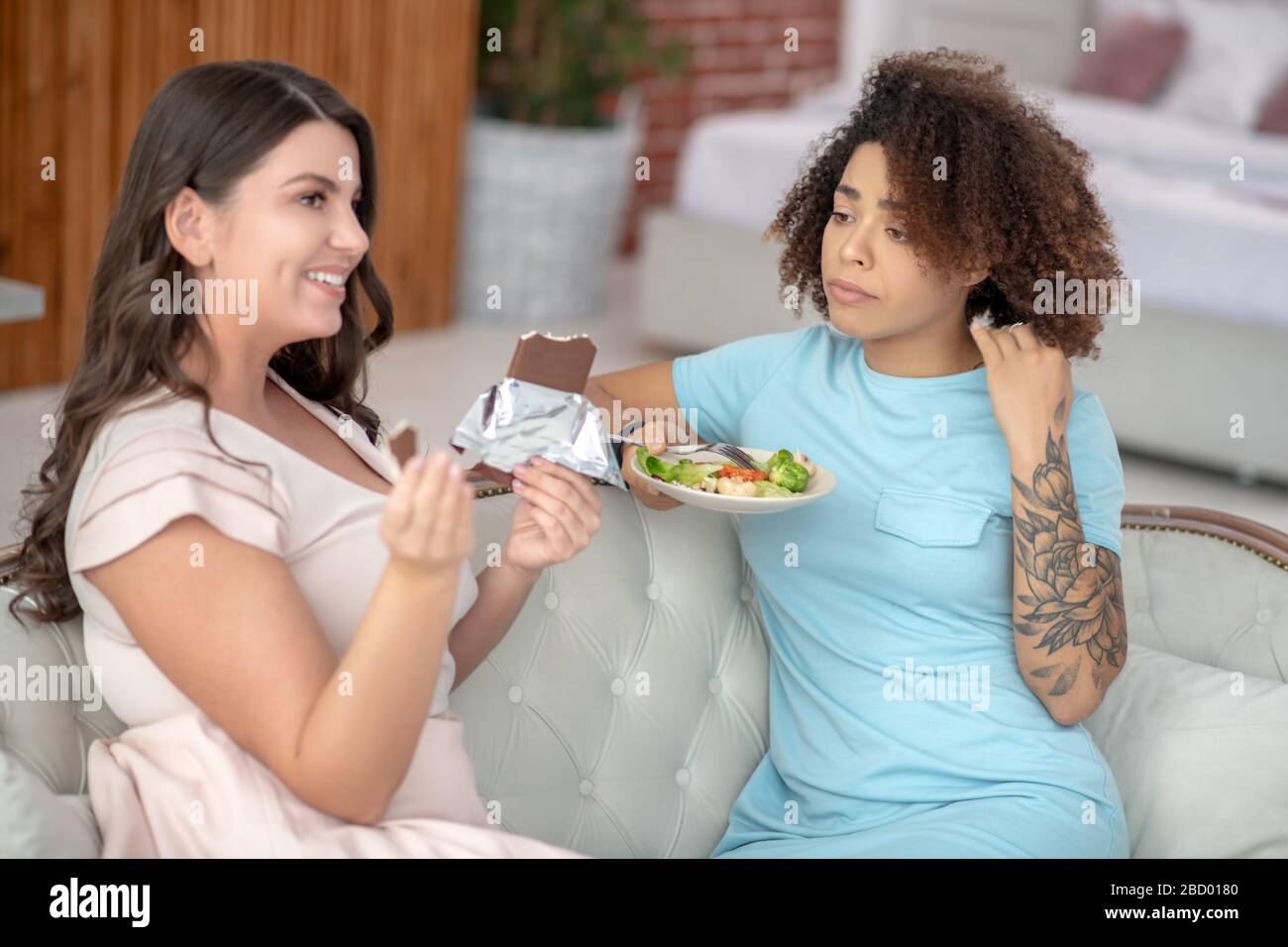 Sad woman eating hi-res stock photography and images - Alamy