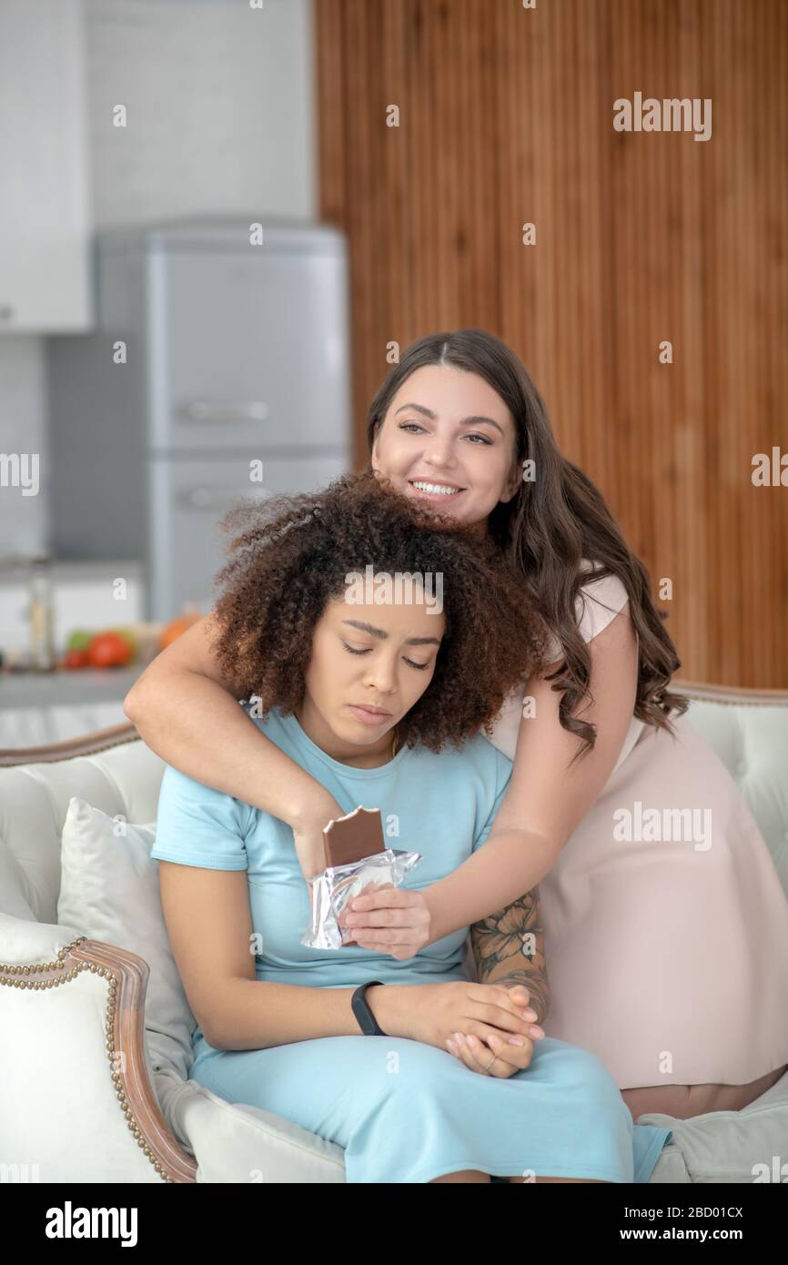 Woman and resisting chocolate hi-res stock photography and images - Alamy