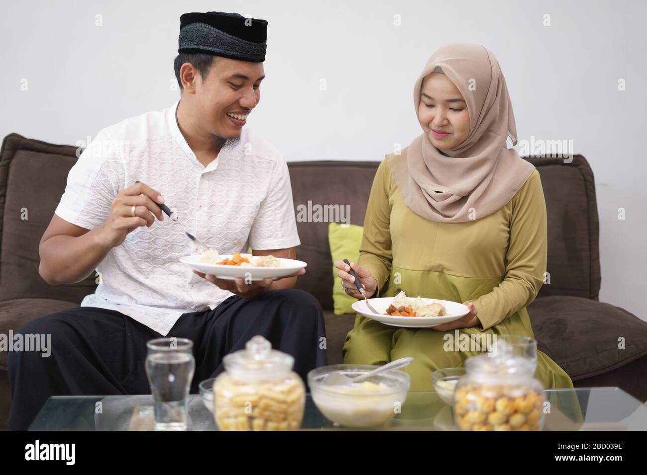 Muslim family having breakfast at home hi-res stock photography and ...
