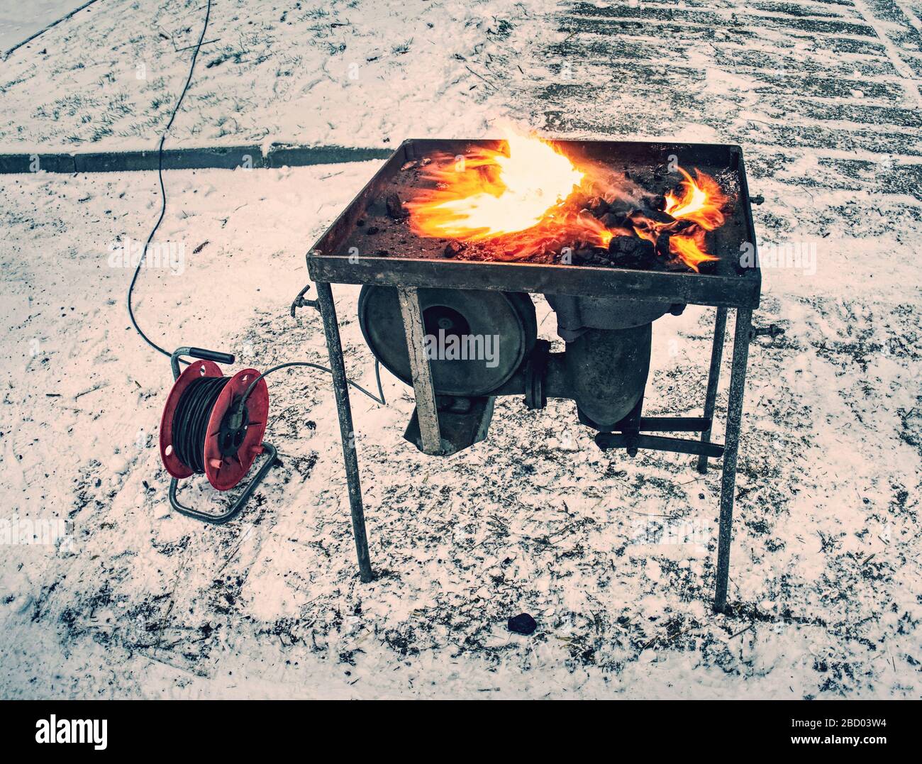 Blacksmiths tool. Old blacksmiths hand oven. Heating of metal by the ...
