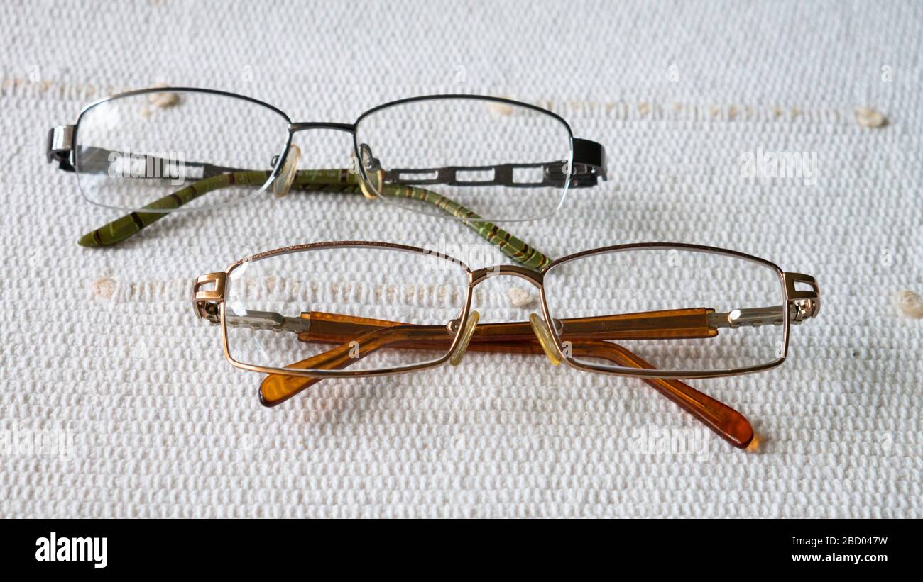 Two pairs of eyeglasses hi-res stock photography and images - Alamy