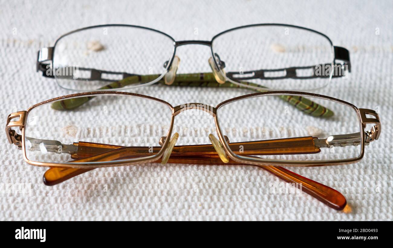 Two pairs of eyeglasses hi-res stock photography and images - Alamy