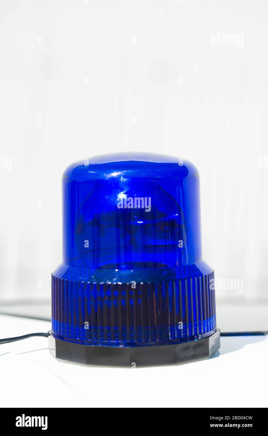 Close up of police blue light atop of an emergency response patrol ...