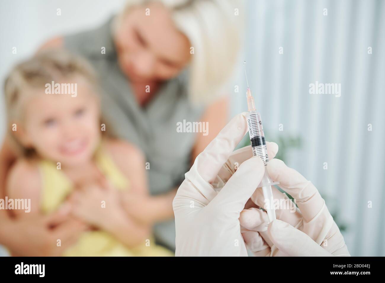 Doctor holding medical injection and getting ready to give an injection ...