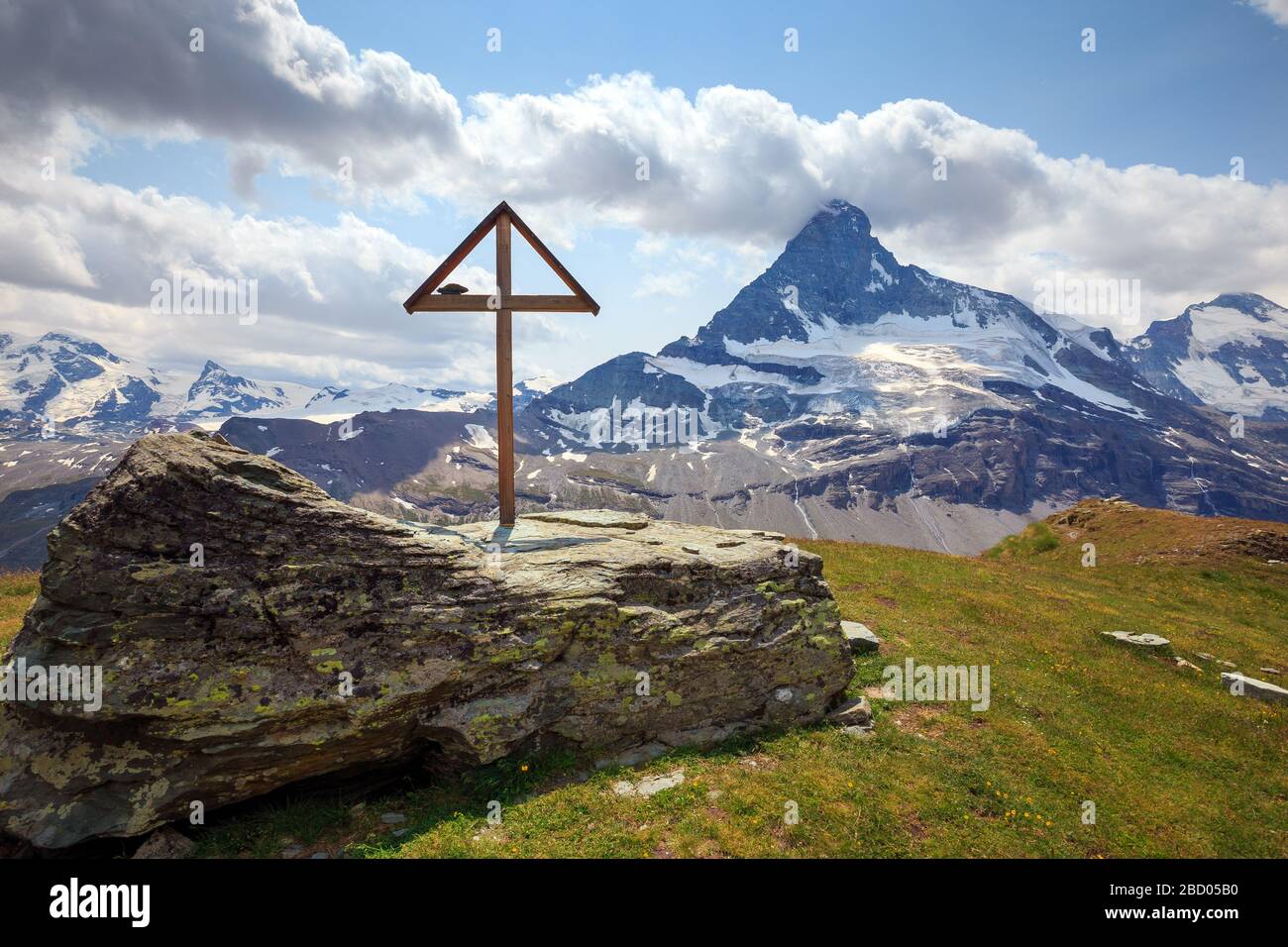 Wooden crucifix on rock in front of the northern slope of the ...