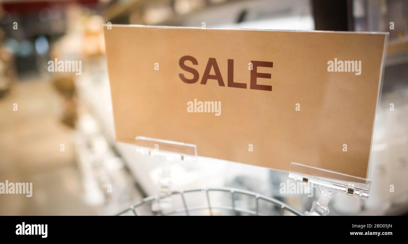 Sale sign display in fashion department store during sale season period ...