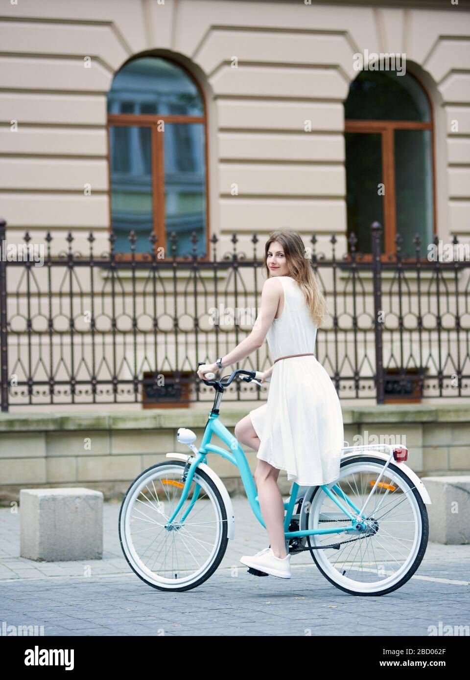 Old lady riding a bike hi-res stock photography and images - Alamy