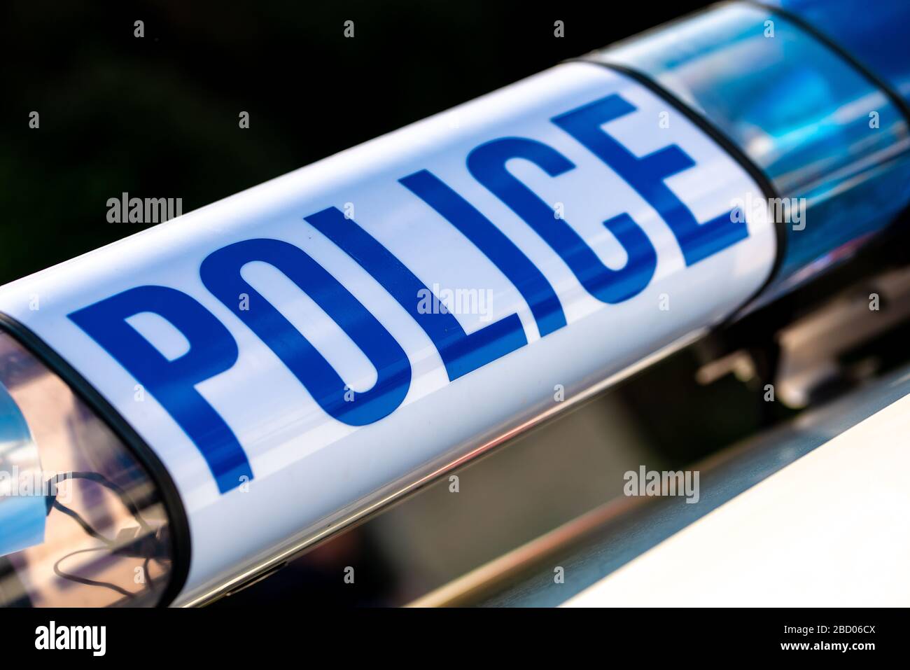 Angled view of POLICE sign with lights, atop an emergency response ...