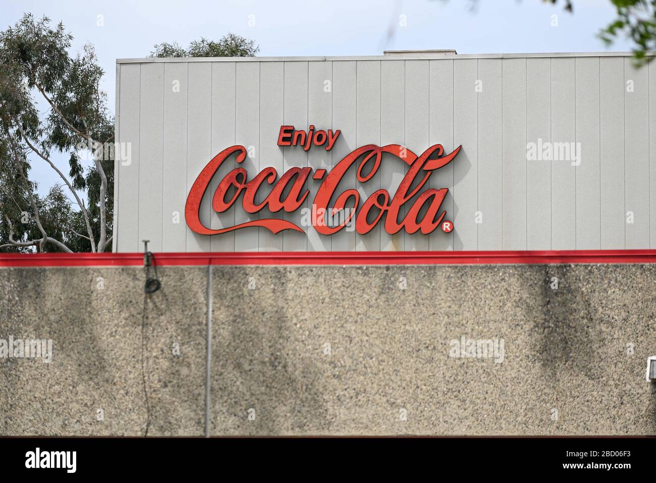 Detailed view of Coca-Cola signage outside a Coca-Cola Bottling Co ...