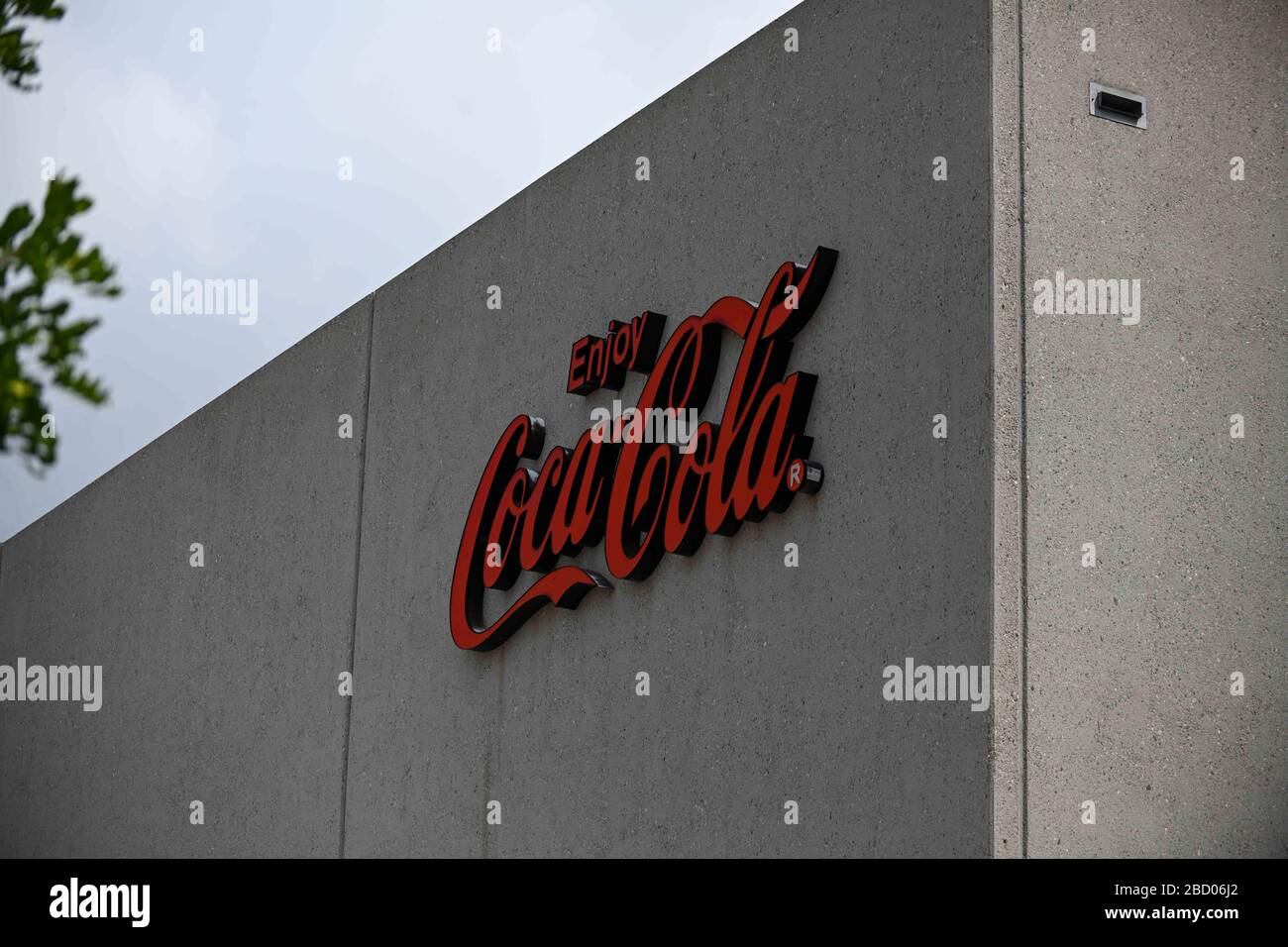 Detailed view of Coca-Cola signage outside a Coca-Cola Bottling Co ...