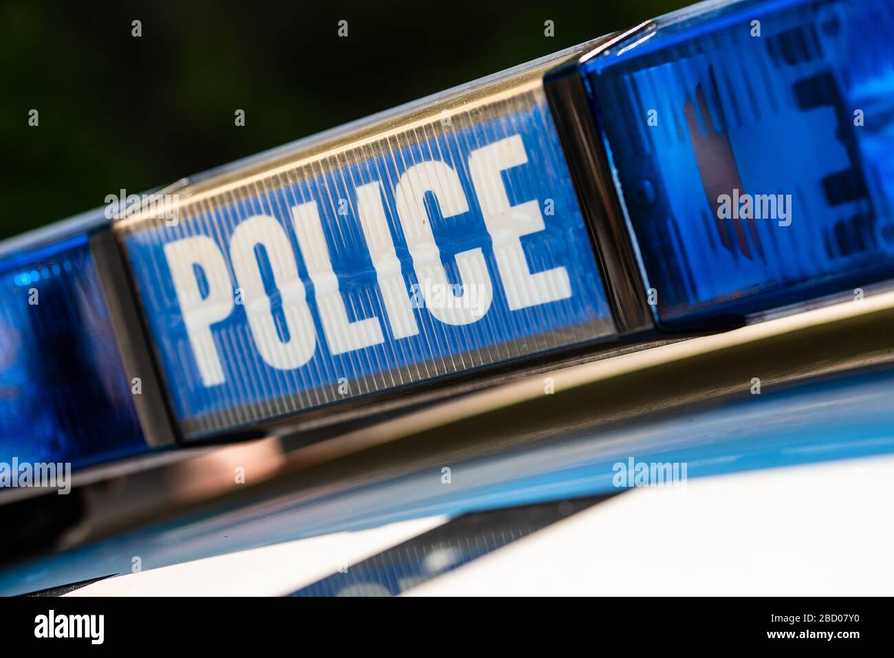 Angled view of POLICE sign with lights, atop an emergency response ...