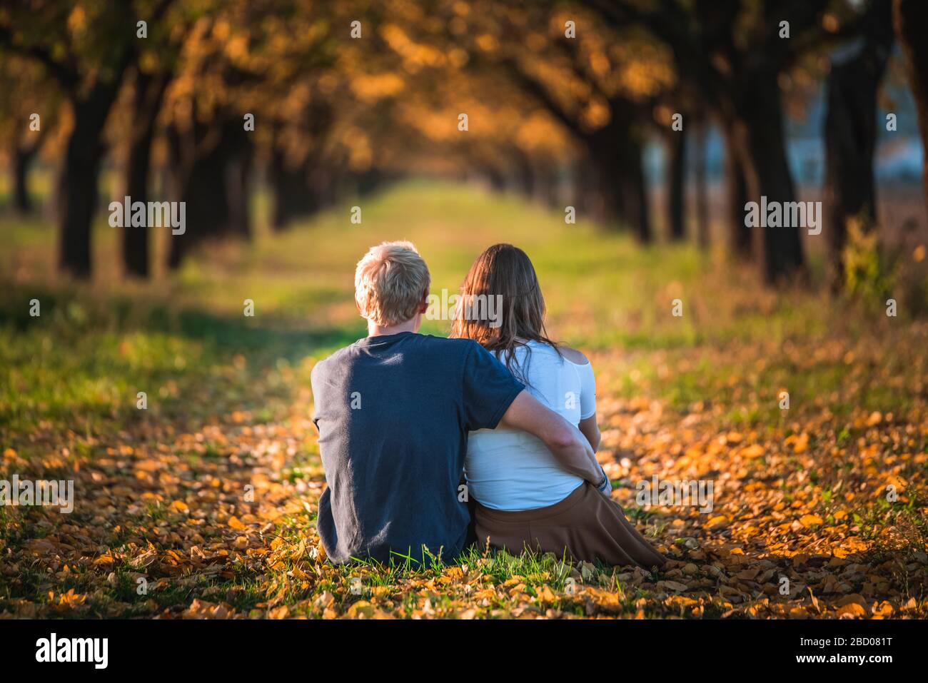 Couple in love in autumn alley. Original photo of love. Date ...