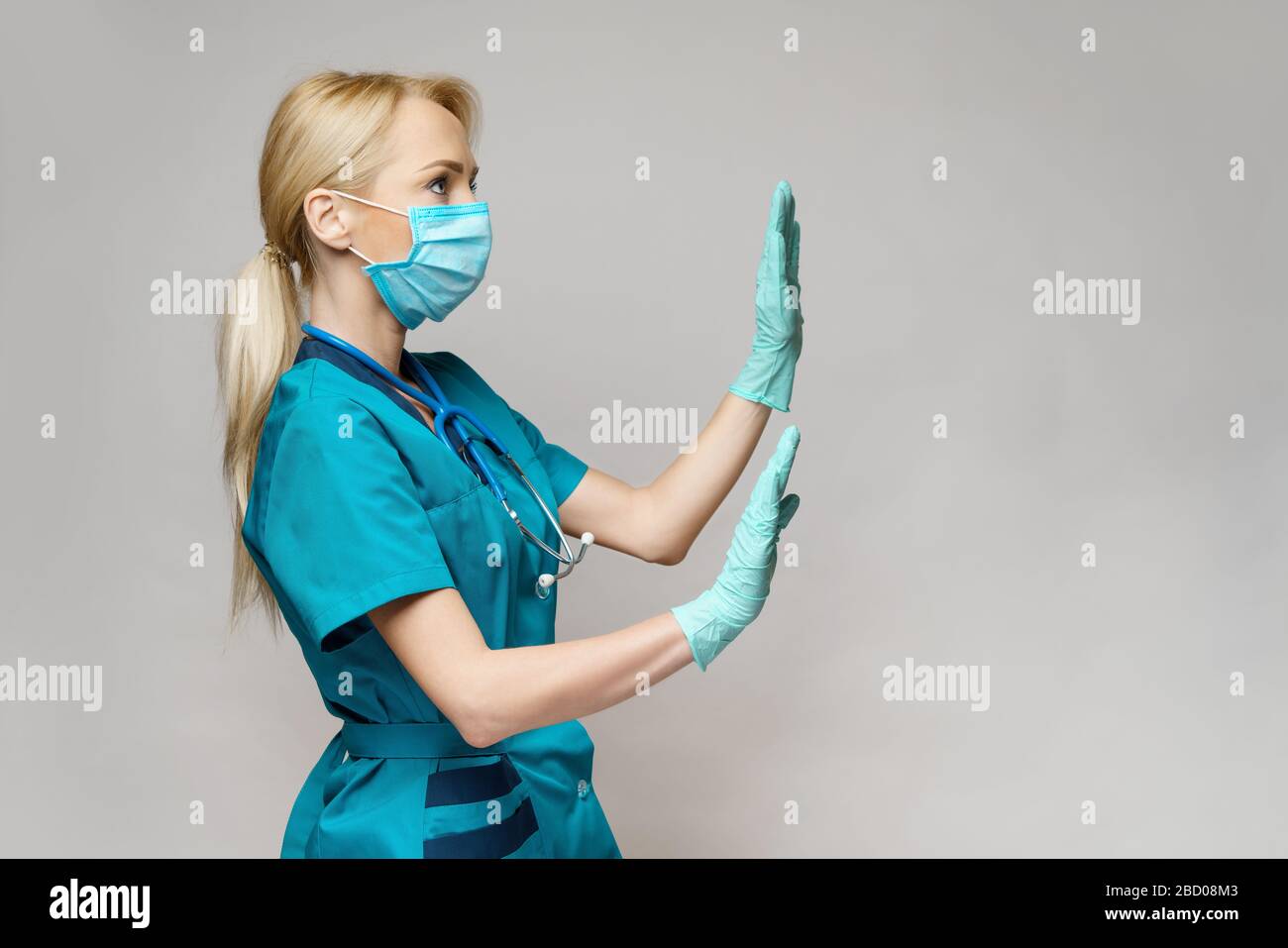 medical doctor nurse woman wearing protective mask and rubber or latex ...