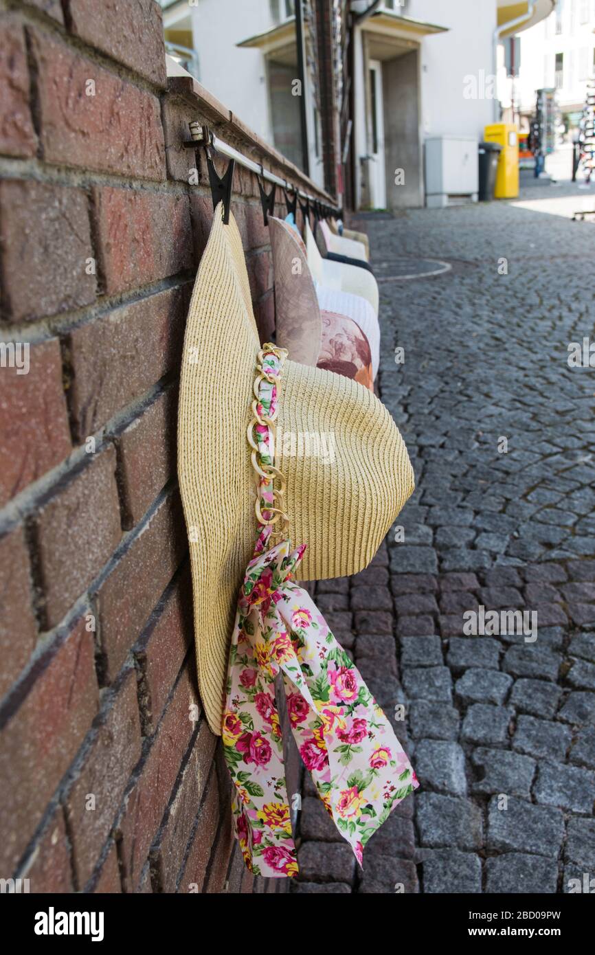 Multi-colored summer hats from natural materials are on sale on the ...