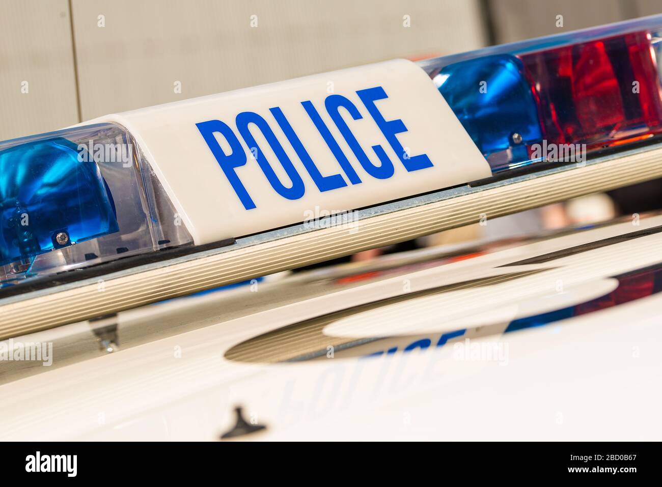 Angled view of POLICE sign with lights, atop an emergency response ...