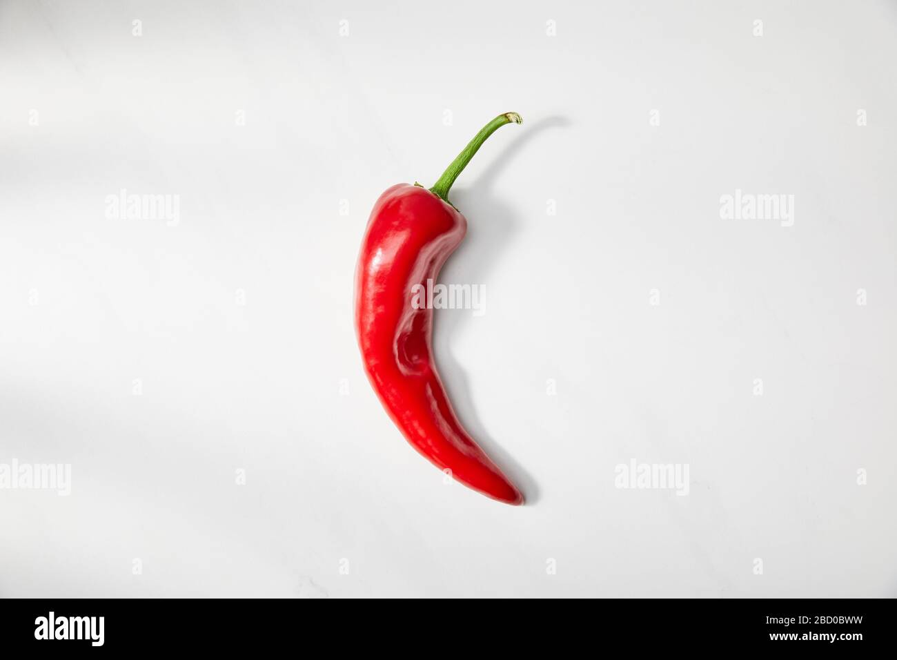 Top view of red chili pepper on white background Stock Photo - Alamy