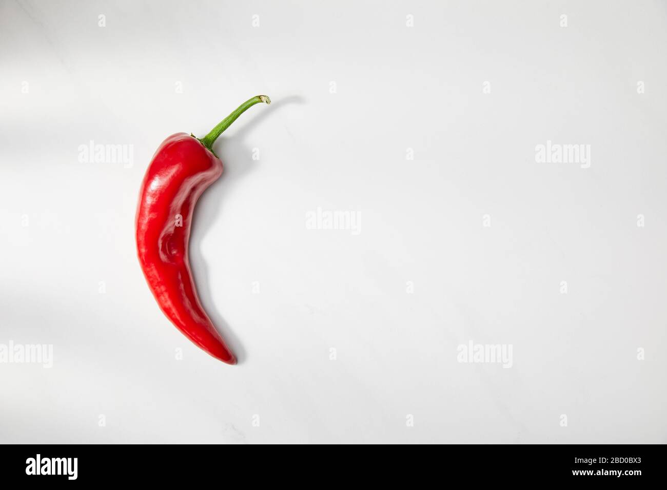 Top view of chili pepper on white background Stock Photo - Alamy